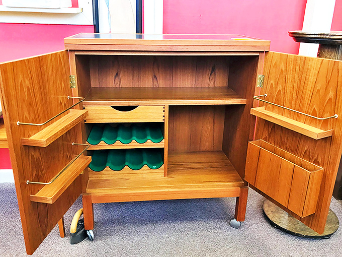 Not just a cabinet, but a mid-century marvel of engineering. Those fold-out shelves and bottle racks were designed for serious entertaining.