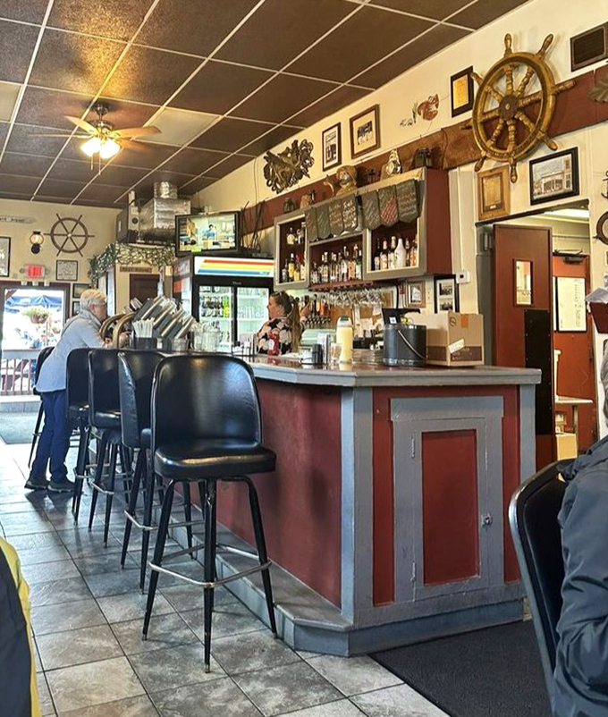 The heart of operations, where maritime history meets culinary magic. That ship's wheel isn't just decoration—it's steering this place to deliciousness.