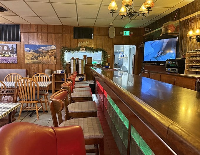 The bar area invites lingering conversations where strangers become friends over shared chicken appreciation.