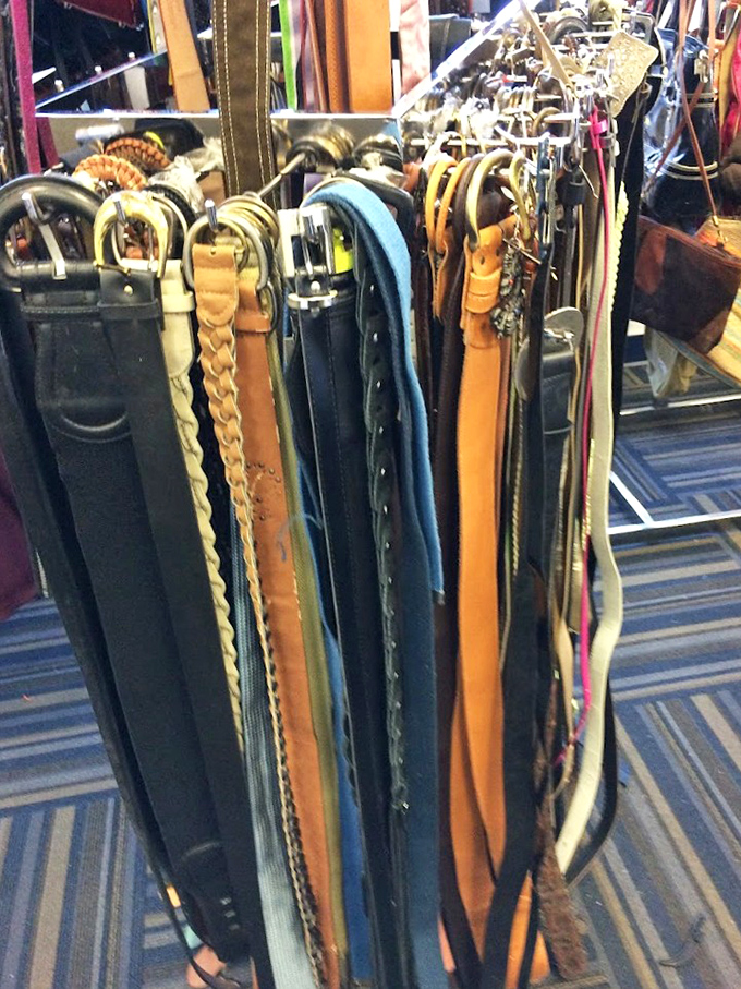 The belt collection hangs like leather spaghetti, a rainbow of options to keep your pants where they belong—around your waist.