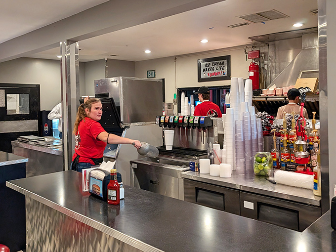 Where the magic happens &ndash; Peach City's counter staff orchestrating the delicate ballet of burgers flipping and milkshakes blending with practiced precision.