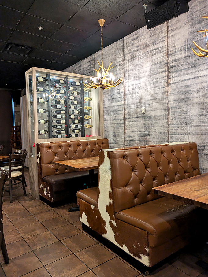 Cowhide-accented booths and a wine display that means business. Seating that invites you to settle in for the long, delicious haul.