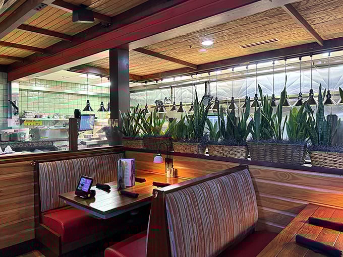 These booths aren't just seating&mdash;they're front-row tickets to a Caribbean getaway, with plants standing in as your personal vacation entourage.