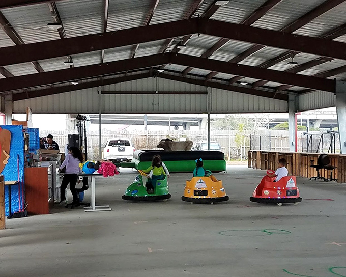 Kids zoom around in bumper cars because apparently shopping wasn't already enough entertainment for one day.