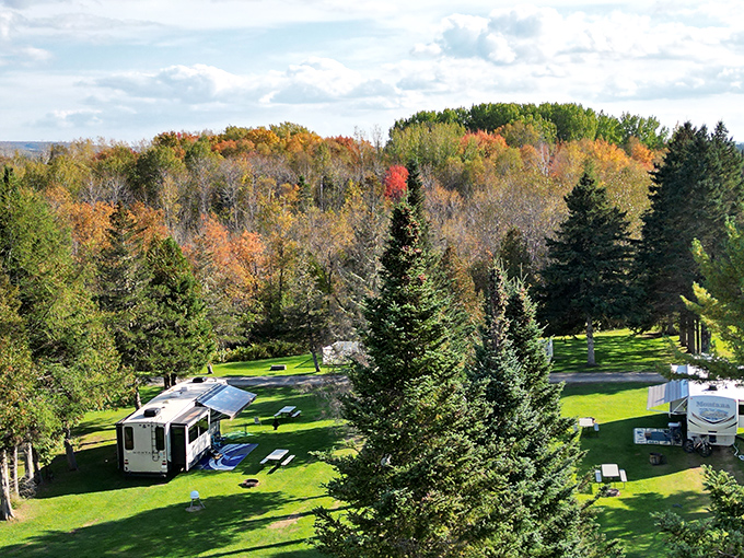 Fall camping in Aroostook County delivers million-dollar views on a motel budget. Those RVs have front-row seats to nature's most spectacular color show.