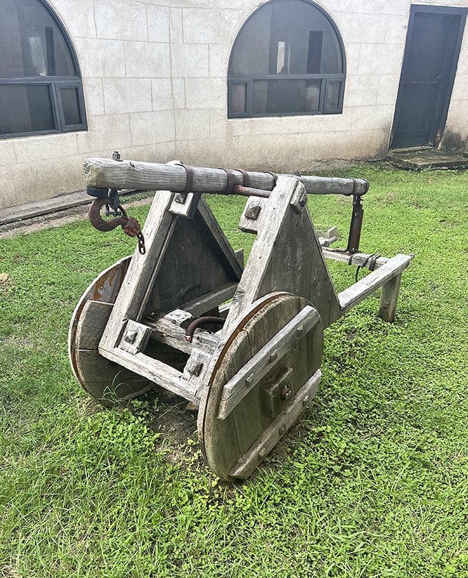 This weathered catapult stands ready for battle, adding authentic medieval warfare equipment to the castle grounds.