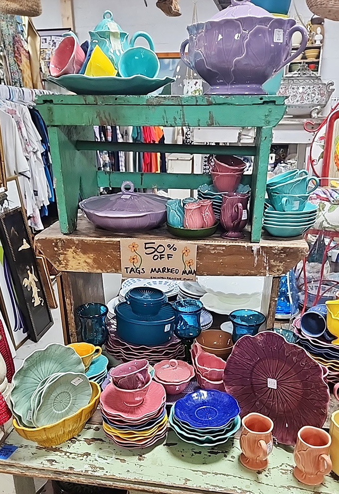 Colorful ceramic collections stacked on rustic shelving&mdash;because your kitchen deserves better than boring white plates.