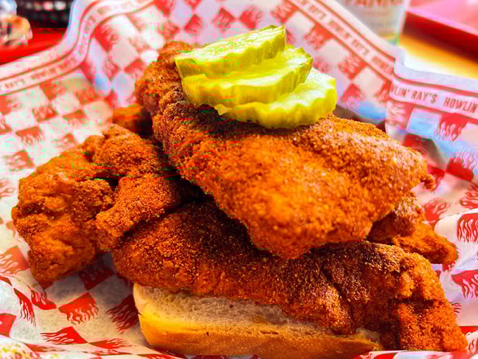 Golden-fried chicken tenders on pillowy white bread with pickle chips&mdash;proof that sometimes the simplest pleasures are the most profound.