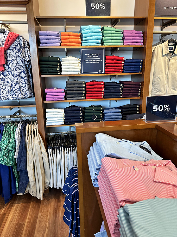 The rainbow wall of polos, where every color of the spectrum stands at attention, waiting to brighten someone's wardrobe and day.