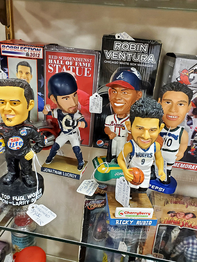 Sports memorabilia that captures legends in plastic perpetuity. Bobbleheads nodding in eternal agreement that these were the glory days.