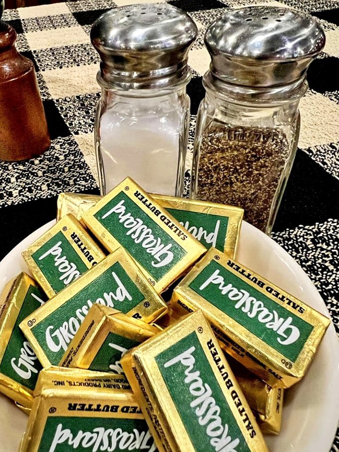 The salt and pepper may be standard issue, but that mountain of Grassland butter packets speaks volumes about Wisconsin's dairy devotion.