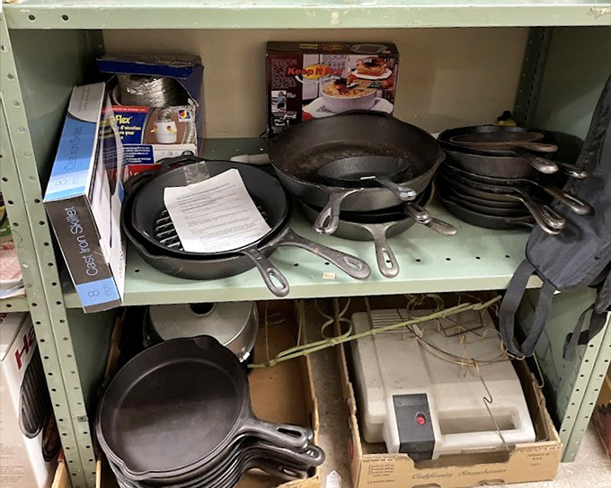Cast iron cookware that's outlived several kitchen trends waits patiently for a new home where it can continue its century-long service.