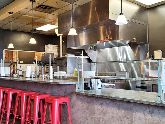 Those bright red stools aren't just seating&mdash;they're front-row seats to watch your meal being crafted with care.