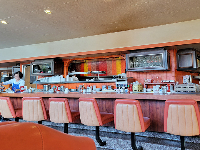 The counter&mdash;where solo diners become temporary family and the coffee keeps flowing like conversation. Diner diplomacy at its finest.