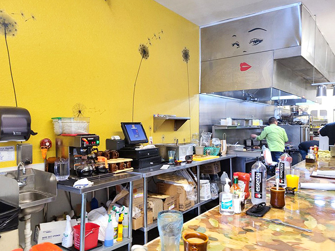 Behind the scenes magic happens in this kitchen, where the yellow wall adds sunshine even on cloudy mornings.