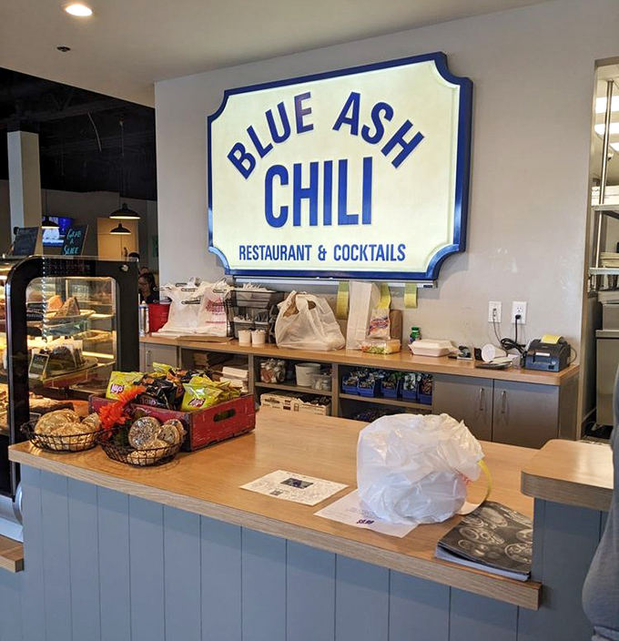 The counter welcomes you with its blue-paneled charm and promises of desserts that will make your diet plans file for divorce.