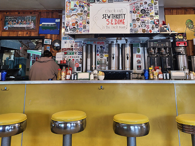 Classic diner stools at the counter offer front-row seats to the breakfast ballet happening in the kitchen.
