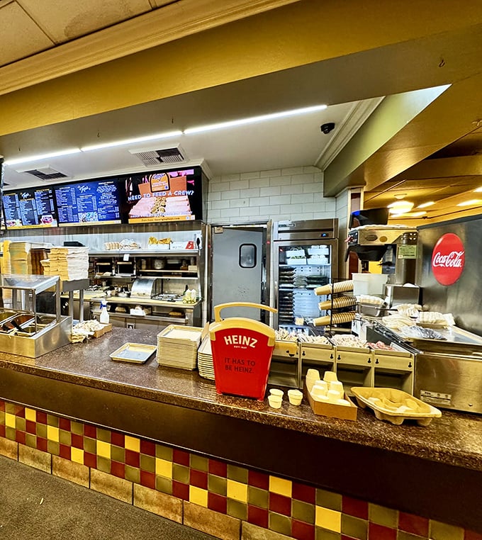 Where burger magic happens. That colorful tile work isn't just decorative&mdash;it's marking sacred culinary ground for Pasadena residents.