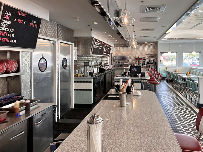 The counter where milkshake dreams come true, complete with classic diner stools that have witnessed countless first dates and family celebrations.