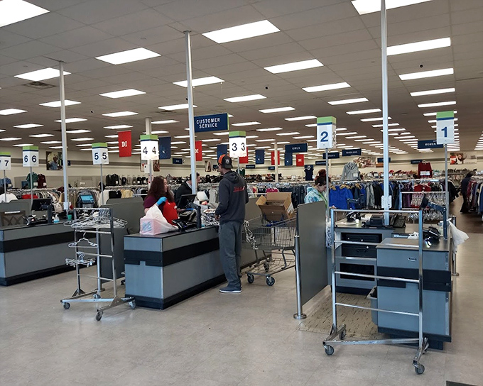 The numbered checkout system brings order to the happy chaos, each station a final stop before newfound treasures head to their forever homes.