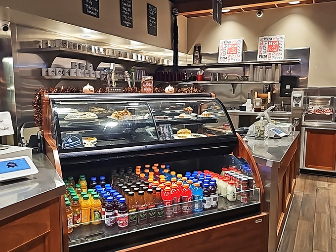 The dessert case stands like a trophy display of sweet victories, with colorful drinks lined up like supporting actors in this food drama.