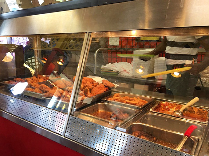 Behind that glass case lies the kind of fried chicken that makes vegetarians question their life choices.