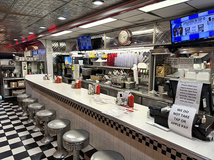 The counter offers front-row seats to the culinary theater, where short-order wizards transform simple ingredients into plates of pure comfort.