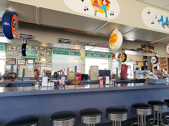 The counter view&mdash;where regulars become family and first-timers become regulars. Those vintage gas station signs aren't decoration; they're conversation starters. 