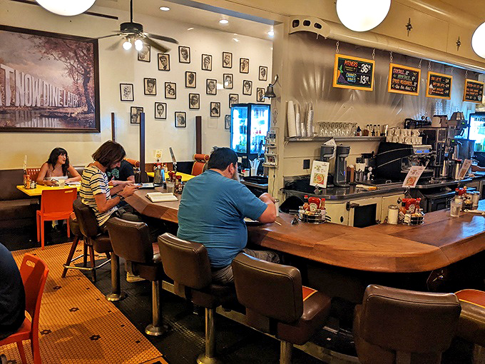 The curved wooden counter offers front-row seats to the ballet of short-order cooking that never gets old.