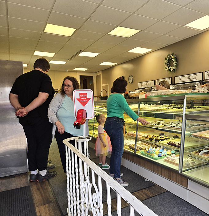 The pilgrimage to the pastry case. Three generations united in the timeless tradition of pointing at delicious things behind glass.