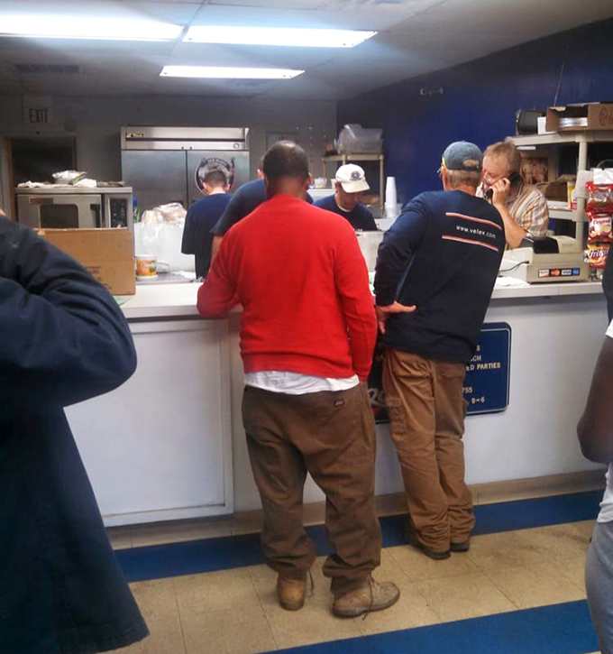 The universal language of sandwich appreciation brings together people from all walks of life. Notice how nobody's looking at their phones&mdash;the food commands full attention.