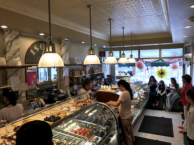 The afternoon rush at Isgro's &ndash; where patience is rewarded with pastry. Some things are worth waiting for, and this is definitely one of them.