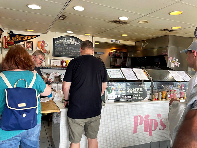 The universal language of anticipation. Customers line up knowing that good things come to those who wait&mdash;especially when those things involve cheese and meat.