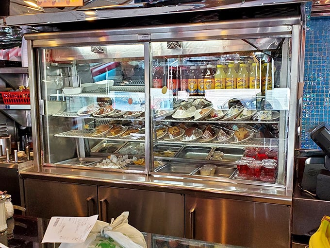 The dessert case &ndash; a glass-enclosed museum of temptation where willpower goes to die a delicious death.