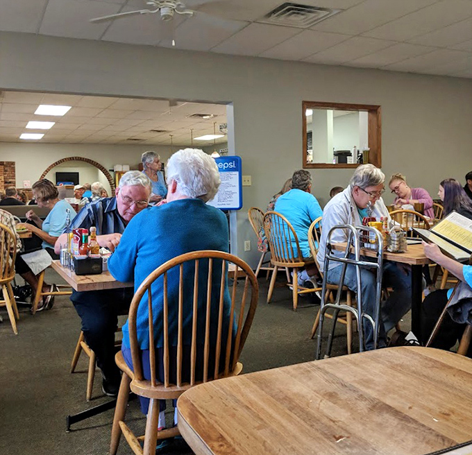 The dining room hums with conversation and silverware clinks &ndash; a community gathering place where strangers become neighbors over pie.