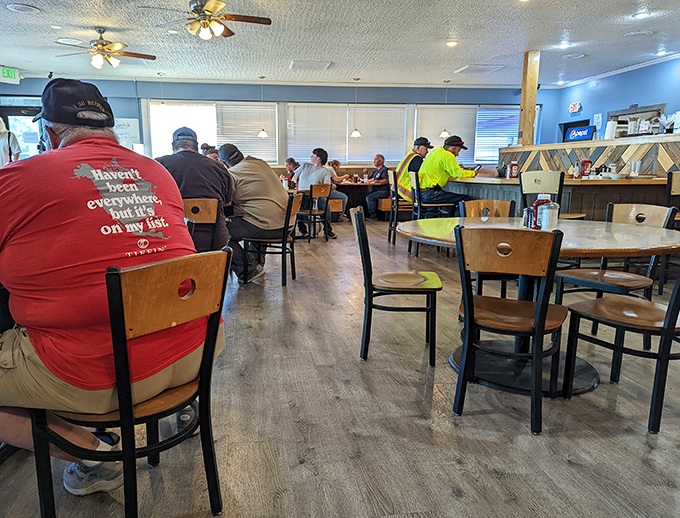 The dining room hums with the satisfied murmurs of regulars who've found their home away from home, complete with ceiling fans and comfort.
