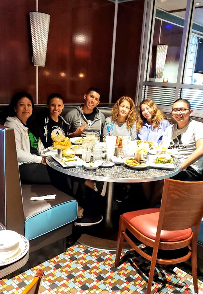 Happy diners around the table tell you everything you need to know about this place's magic.