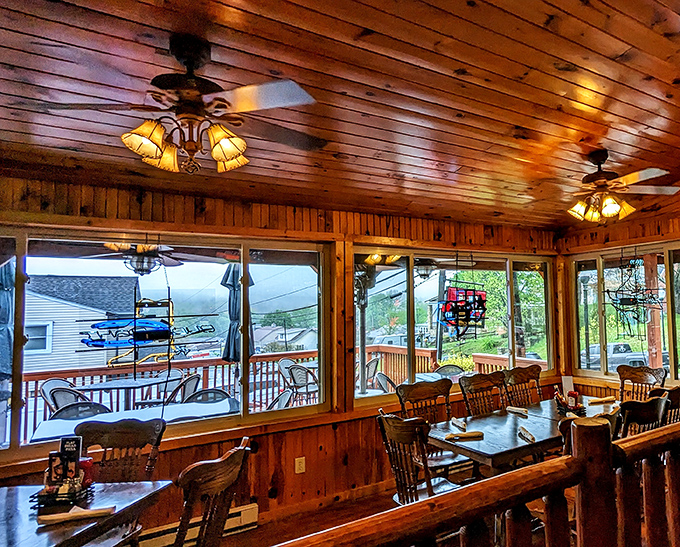 The sunlit dining area with its wooden ceiling and panoramic windows brings the stunning Maryland landscape right to your table.
