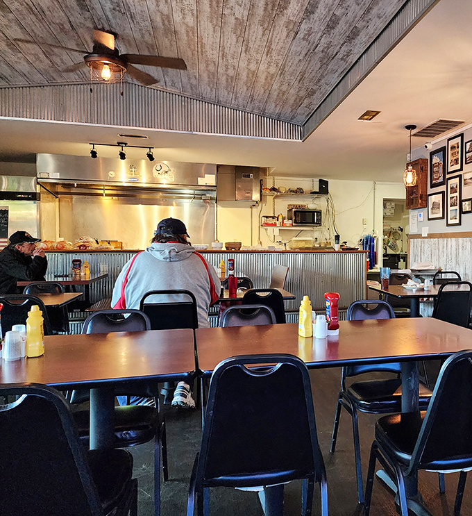 The open kitchen layout lets you witness the breakfast ballet, where spatulas dance and eggs perform their morning pirouettes.