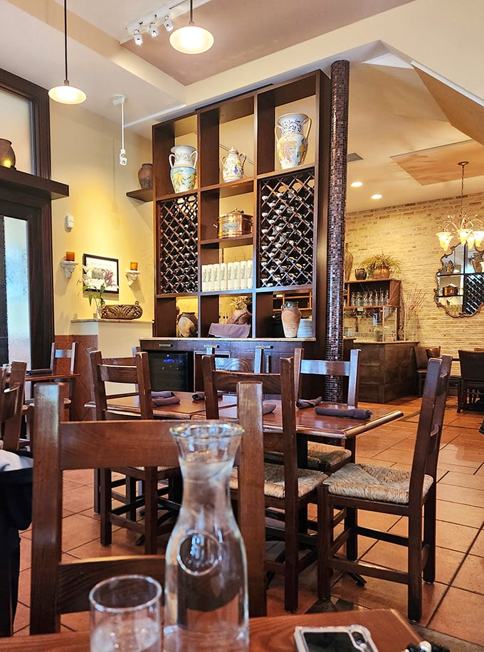 The dining room whispers "stay awhile" &ndash; rustic wooden tables, Italian ceramics, and wine racks create an atmosphere where meals become memories.