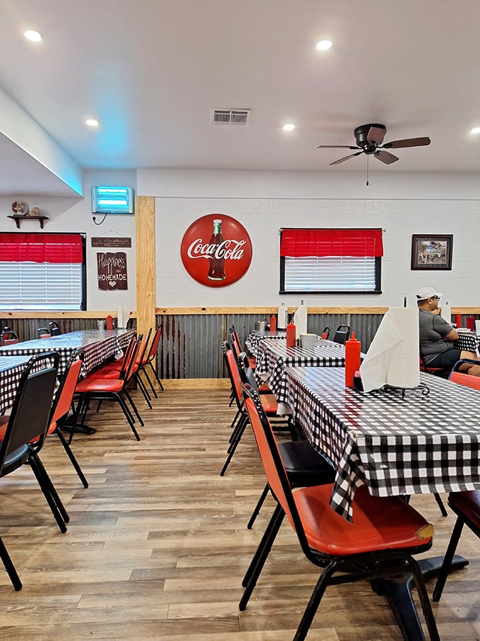 The dining room's classic Americana vibe with checkered tablecloths makes every meal feel like a hometown gathering.