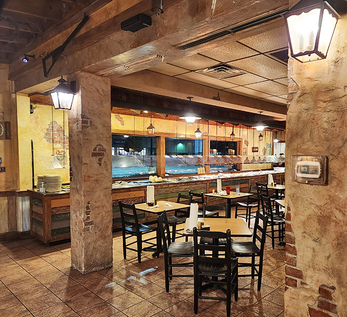 Rustic columns frame dining spaces where memories are made. The worn brick whispers stories of countless meals shared among friends and family.