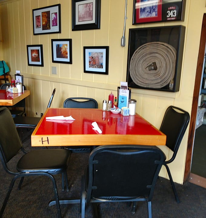 Firefighter memorabilia adorns yellow walls while red-topped tables invite you to settle in for some serious eating.