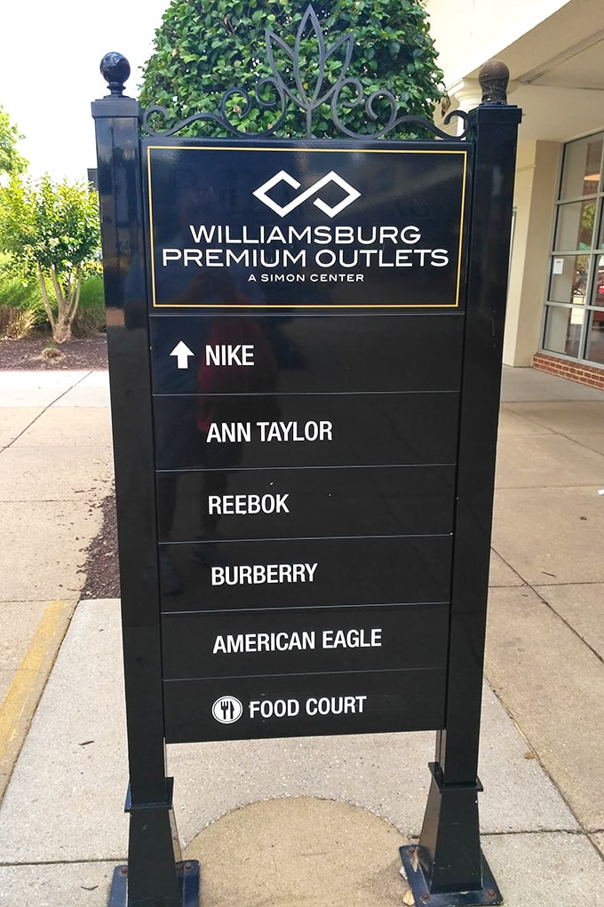 The directory sign stands like a treasure map, guiding eager shoppers to their next great find. X marks the discount!