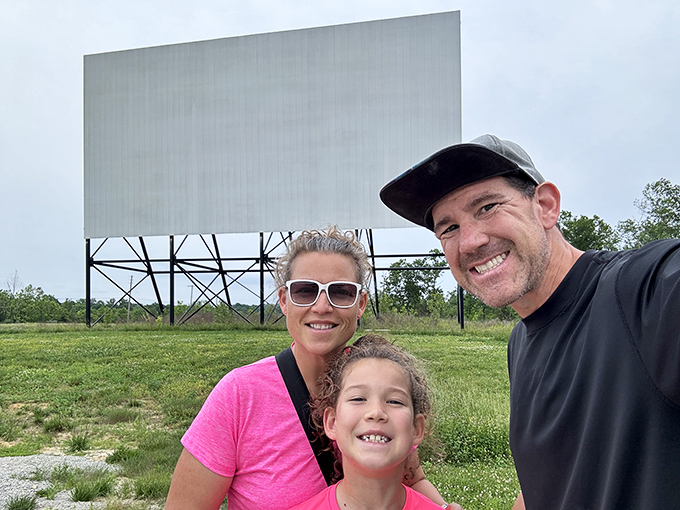 Family memories in the making, with the iconic screen providing the perfect backdrop for togetherness in the digital age.