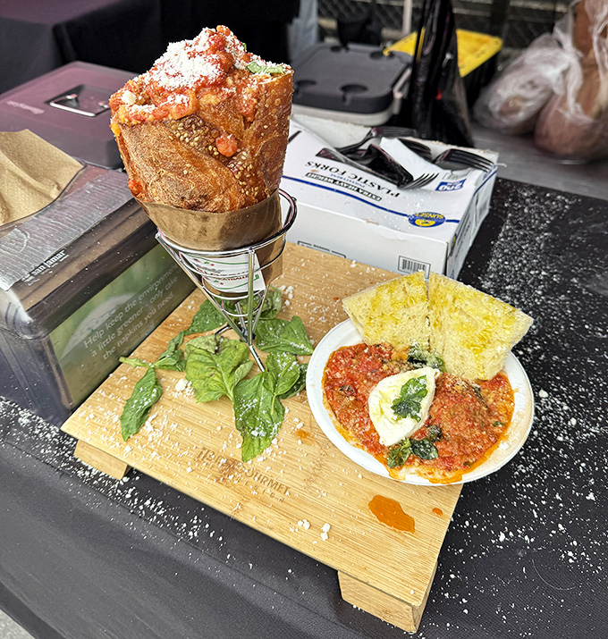 Tower of carbs meets saucy companion! This architectural achievement in comfort food demands both appreciation and napkins in equal measure.