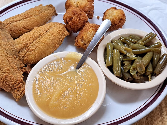 Cornmeal-crusted fish fillets with hushpuppies, applesauce, and green beans. The holy trinity of Southern cooking: something fried, something sweet, something green.