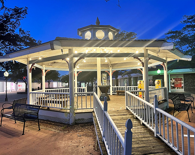 The gazebo transforms into a magical gathering spot at dusk. Twinkling lights create the perfect ambiance for resting tired feet and comparing shopping victories.