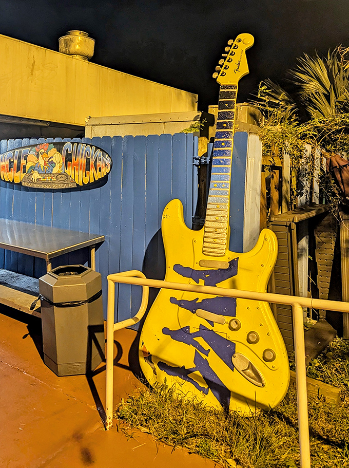A giant yellow guitar stands guard outside&mdash;because great food deserves its own soundtrack. Rock on, flavor town!