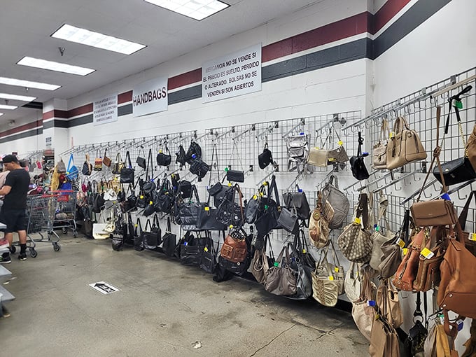 Designer bags hanging casually on wire racks like they didn't cost someone a month's rent originally.